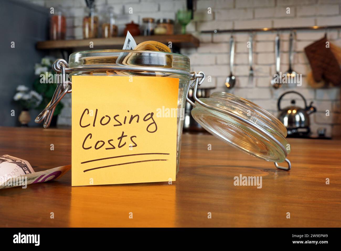 Jar with mark closing costs in home Stock Photo - Alamy