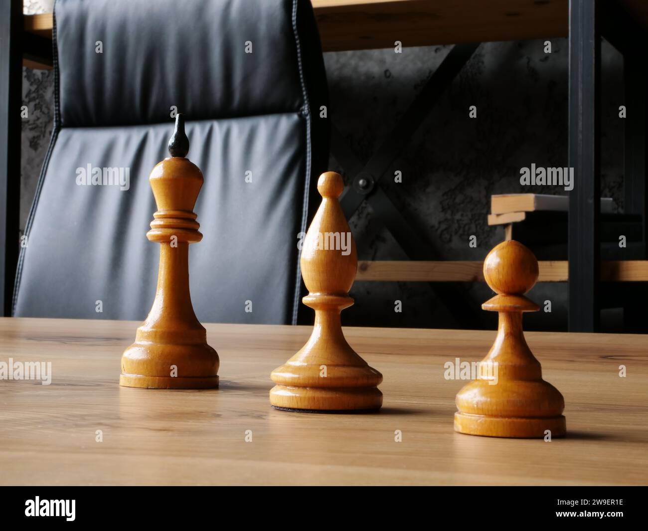 Chess pieces with a king as a symbol of succession planning and ...