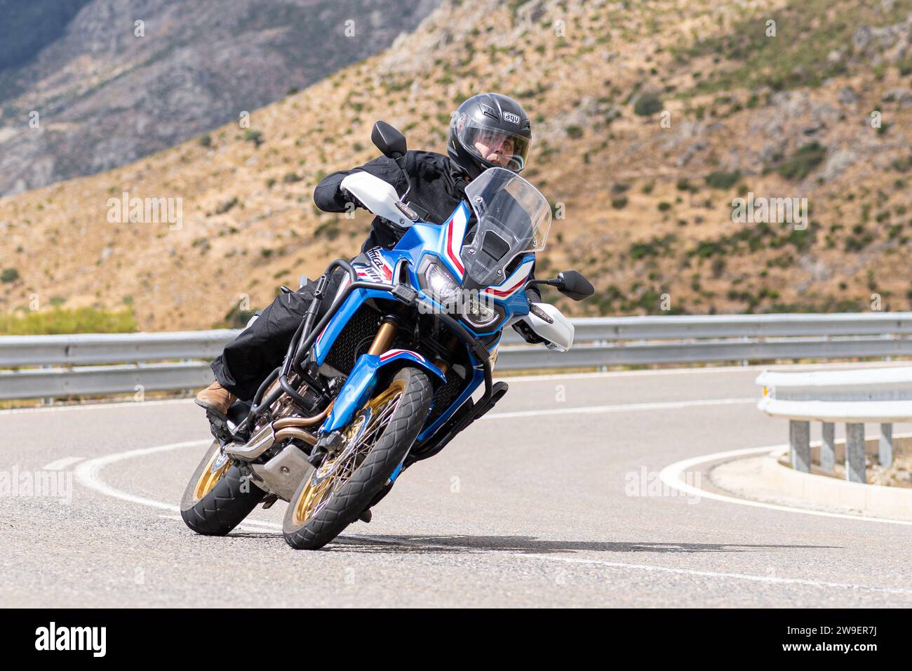 man on his motorcycle taking a sharp curve in the port of Navalmoral ...