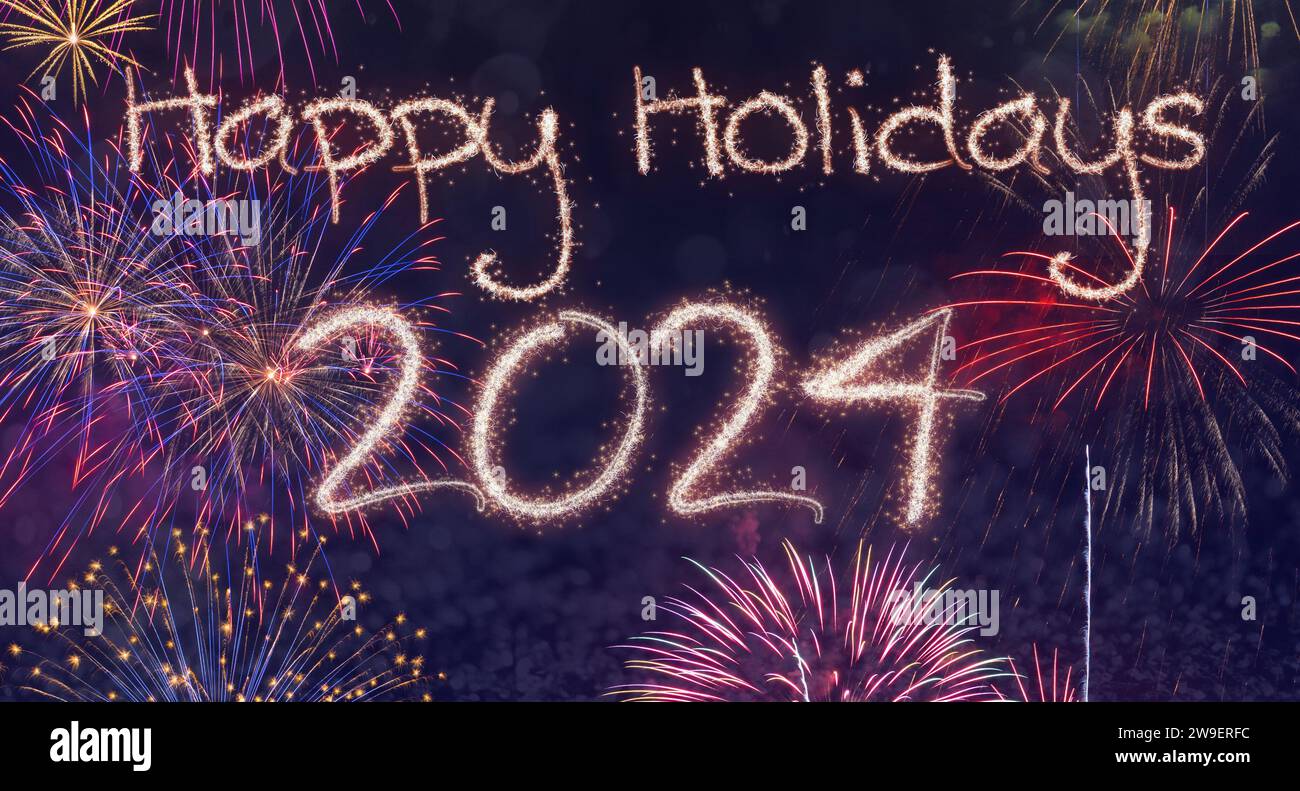Festive 2024 happy holidays message with vibrant fireworks in the night ...