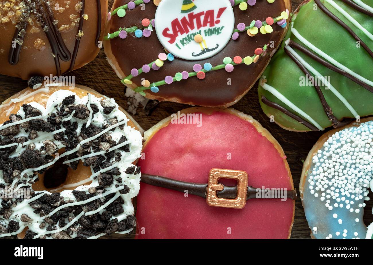 Many Glazed Doughnuts placed on wooden cutting board. The concept of ...