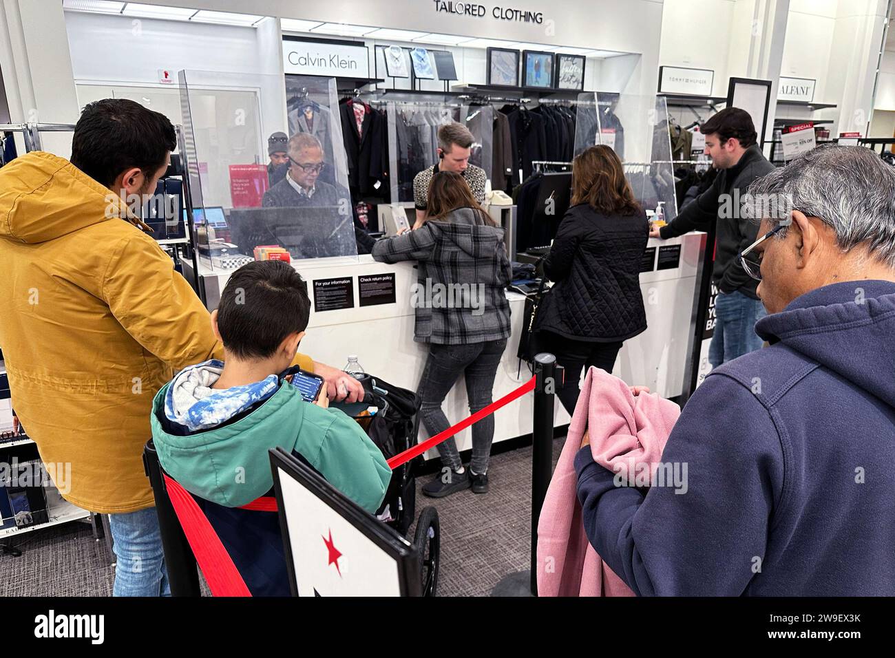 Shoppers line up for purchases at a retail store in Schaumburg, Ill ...