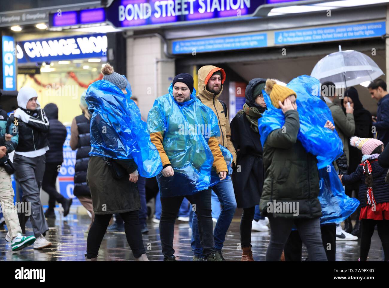London, UK, 27th December 2023. Shoppers braved the gusty winds and heavy rain showers of Storm ...