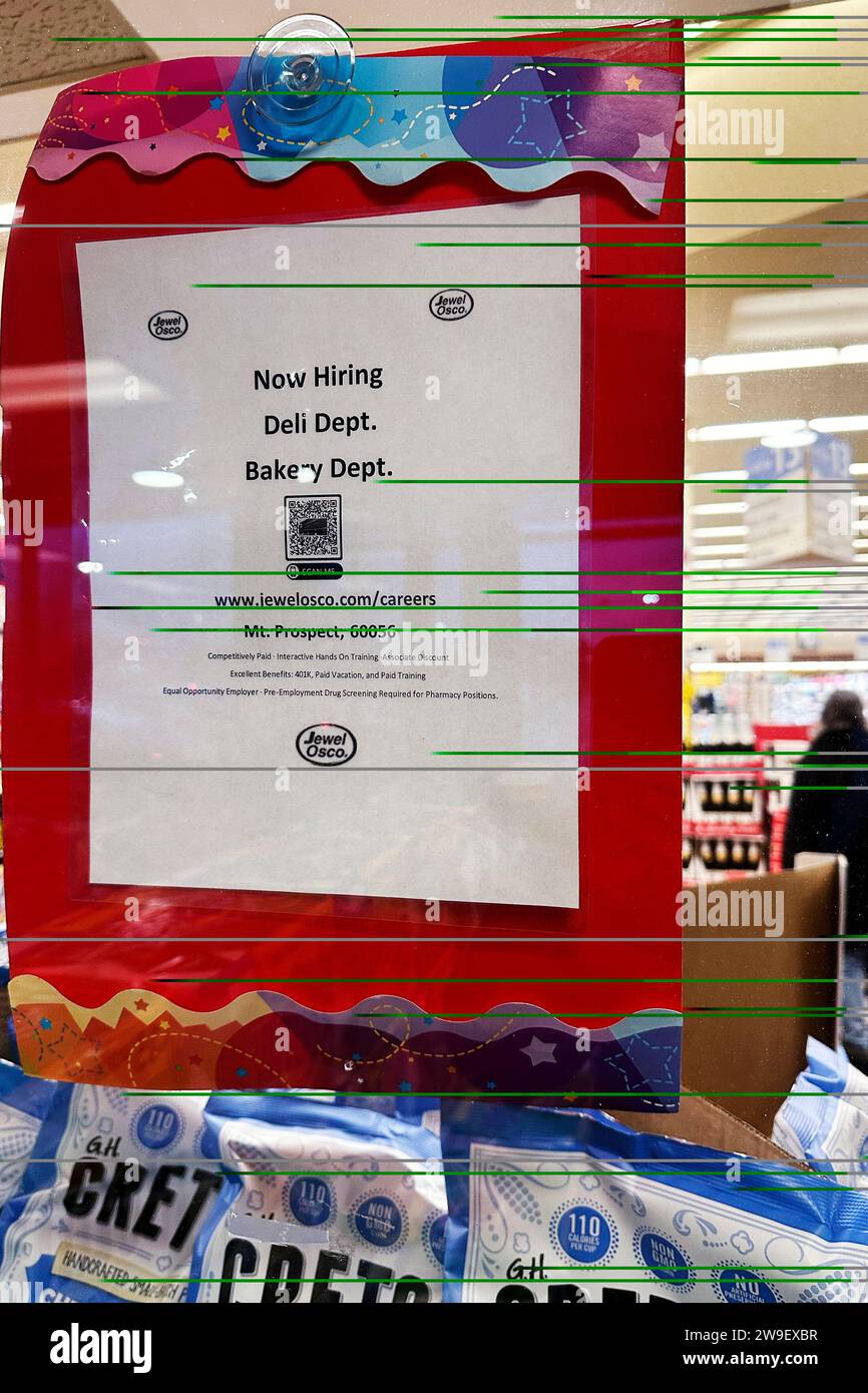 A hiring sign is displayed at a grocery store in Mount Prospect, Ill ...