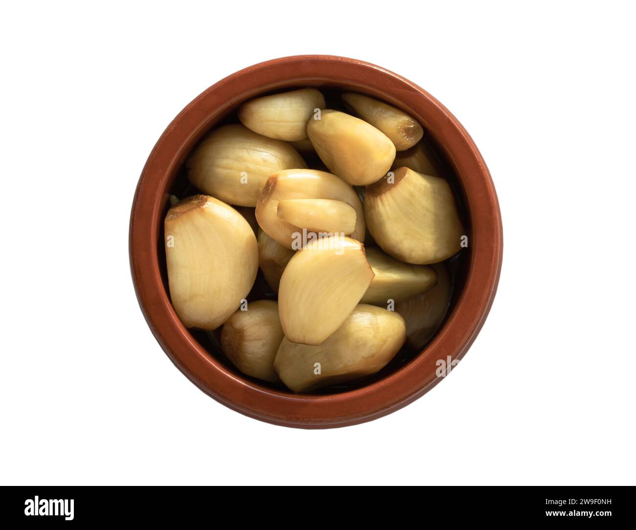 Garlic pickled in Apple cider vinegar with Rock sugar in jar bowl ...