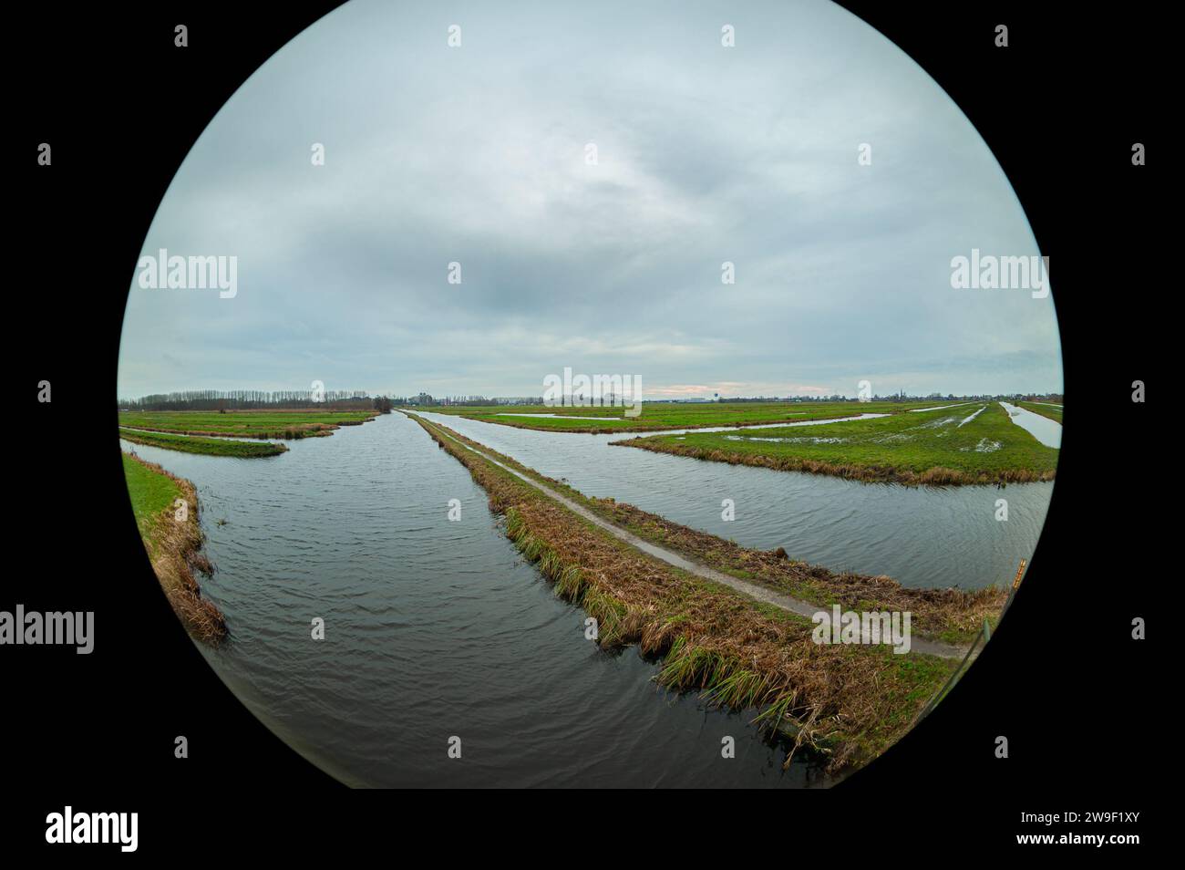 Circular fisheye view of a small path in the Dutch watery landscape ...