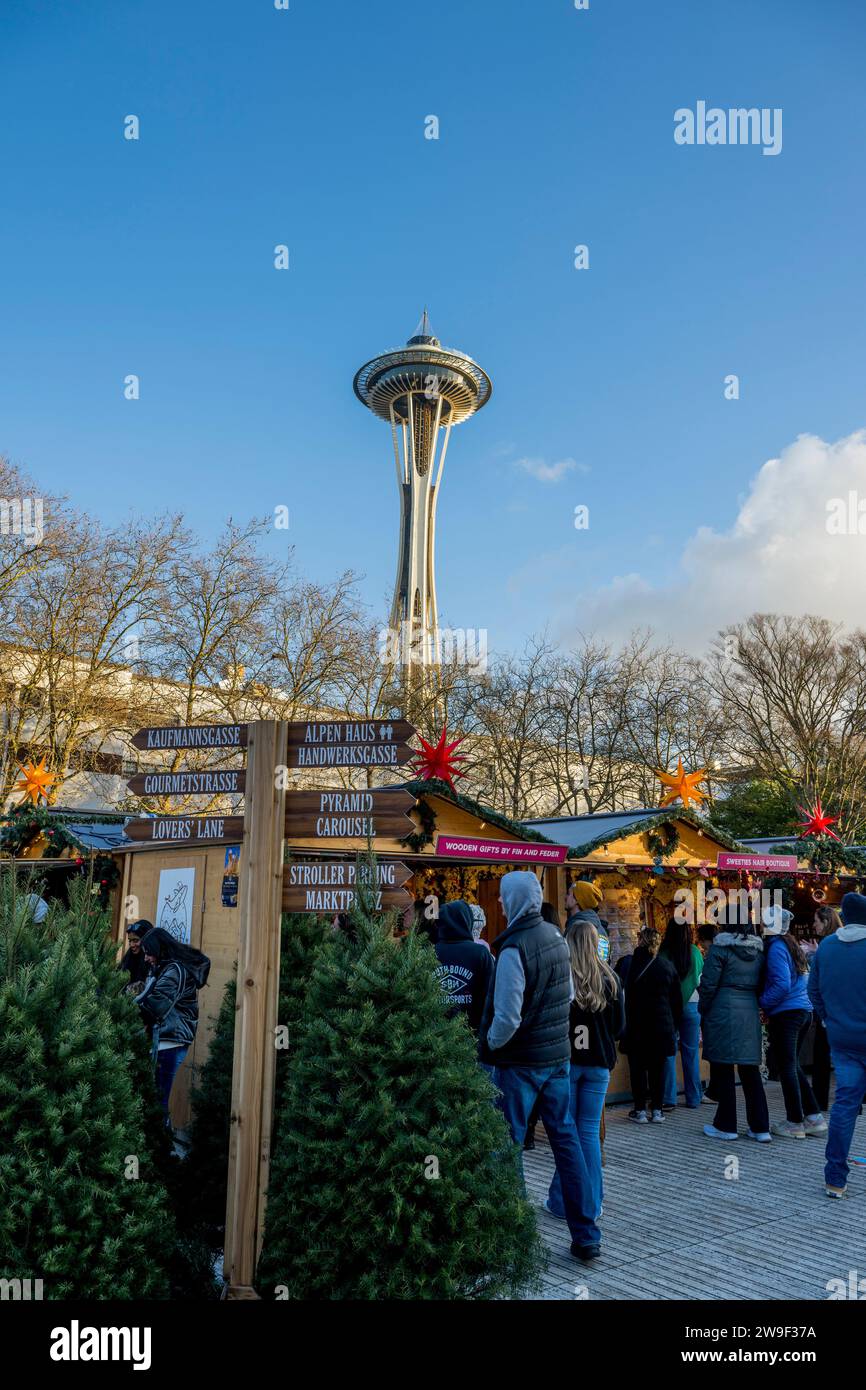 Seattle Christmas Market scene with vendors and the Space Needle at the ...