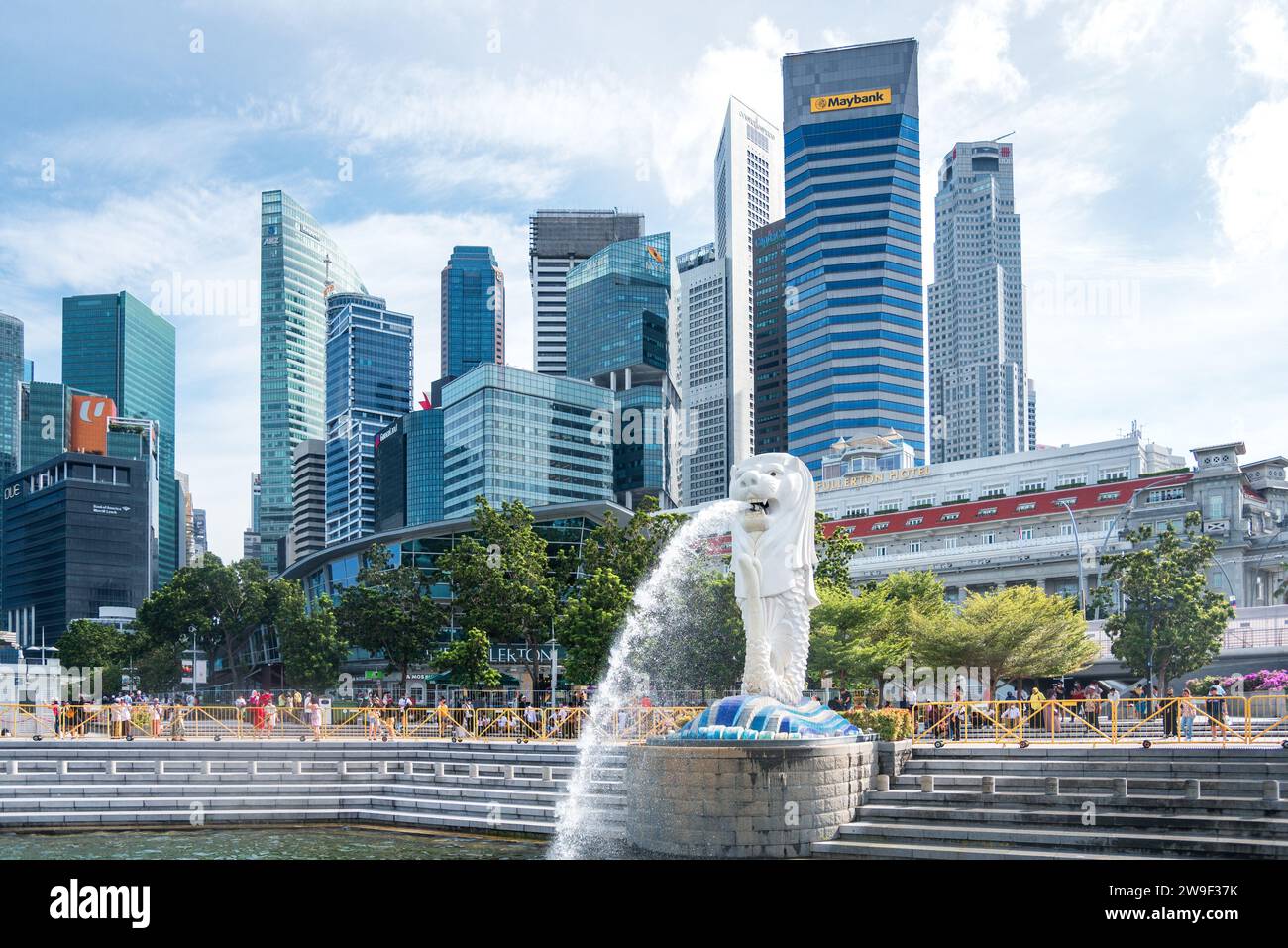 A group of people enjoying a leisurely boat ride on a sunny day at a ...
