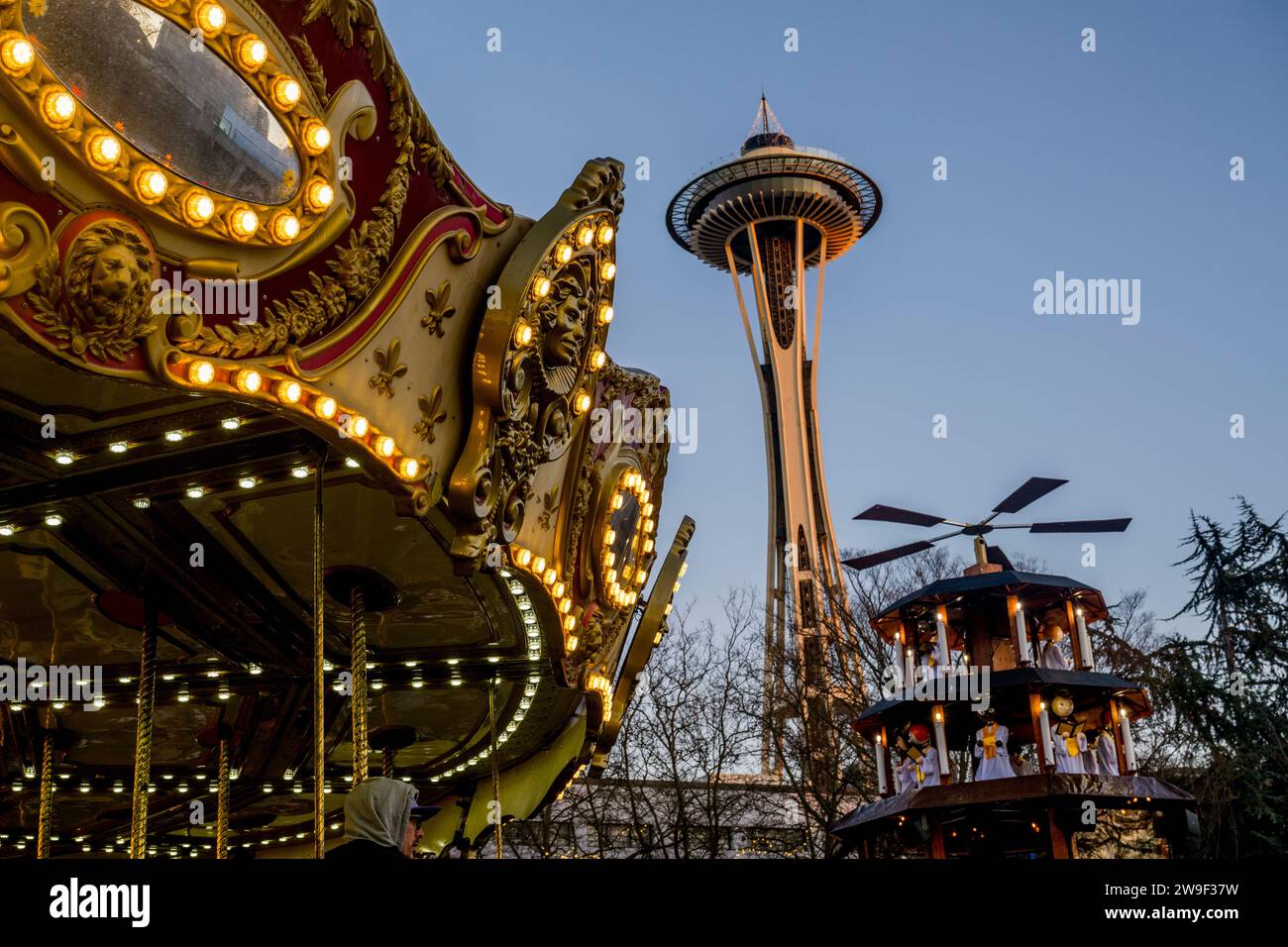 Seattle Christmas Market scene with a merry-go-round, holiday lights ...