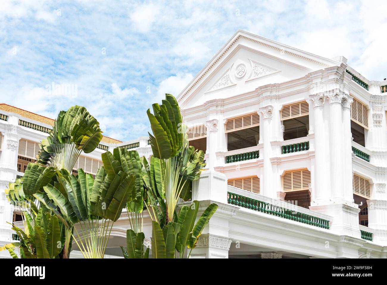 The Raffles Hotel Singapore against the clear blue sky Stock Photo - Alamy