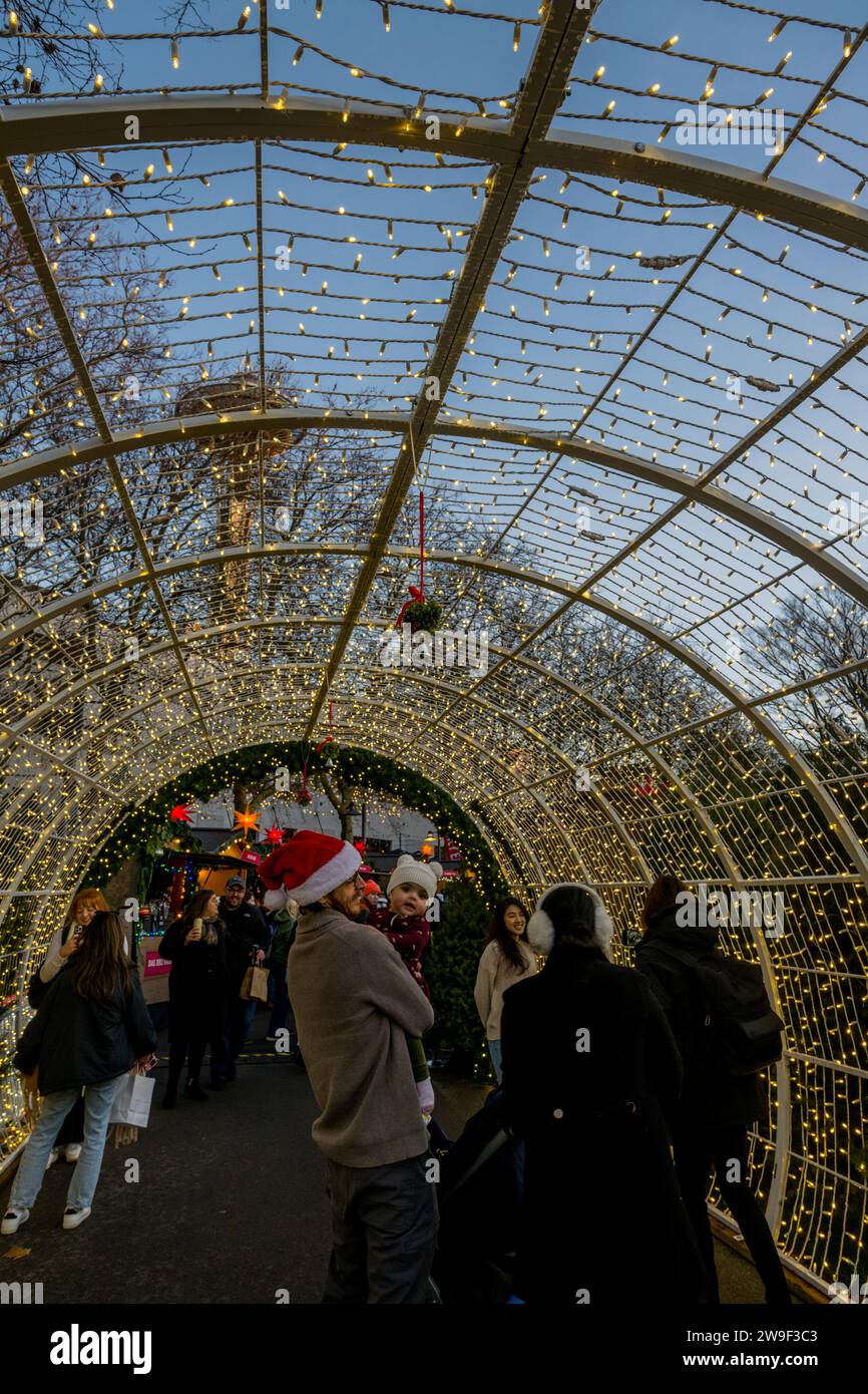 People in the light tunnel at the Seattle Christmas Market at the ...