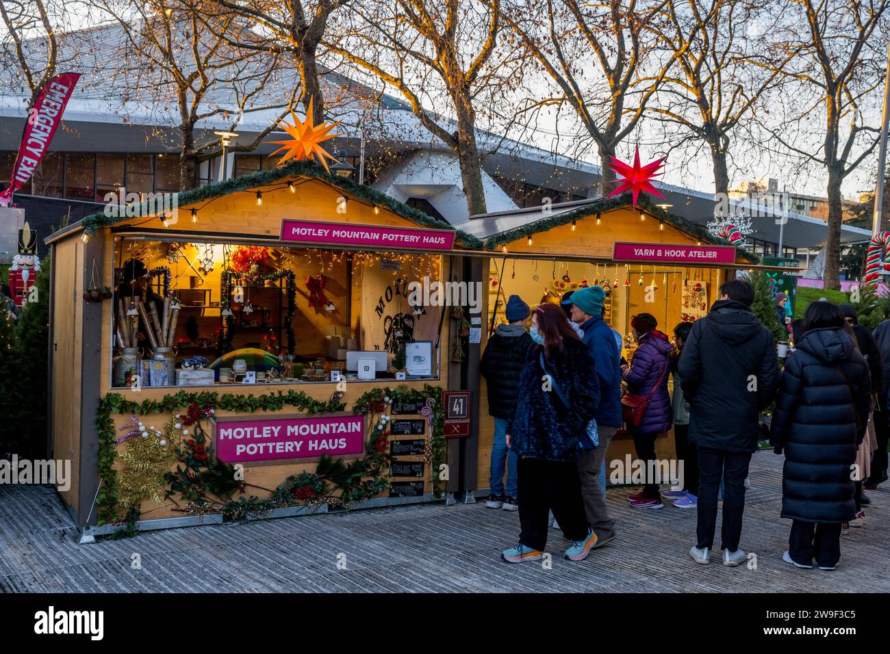 Seattle Christmas Market scene with vendor huts, holiday lights, and ...