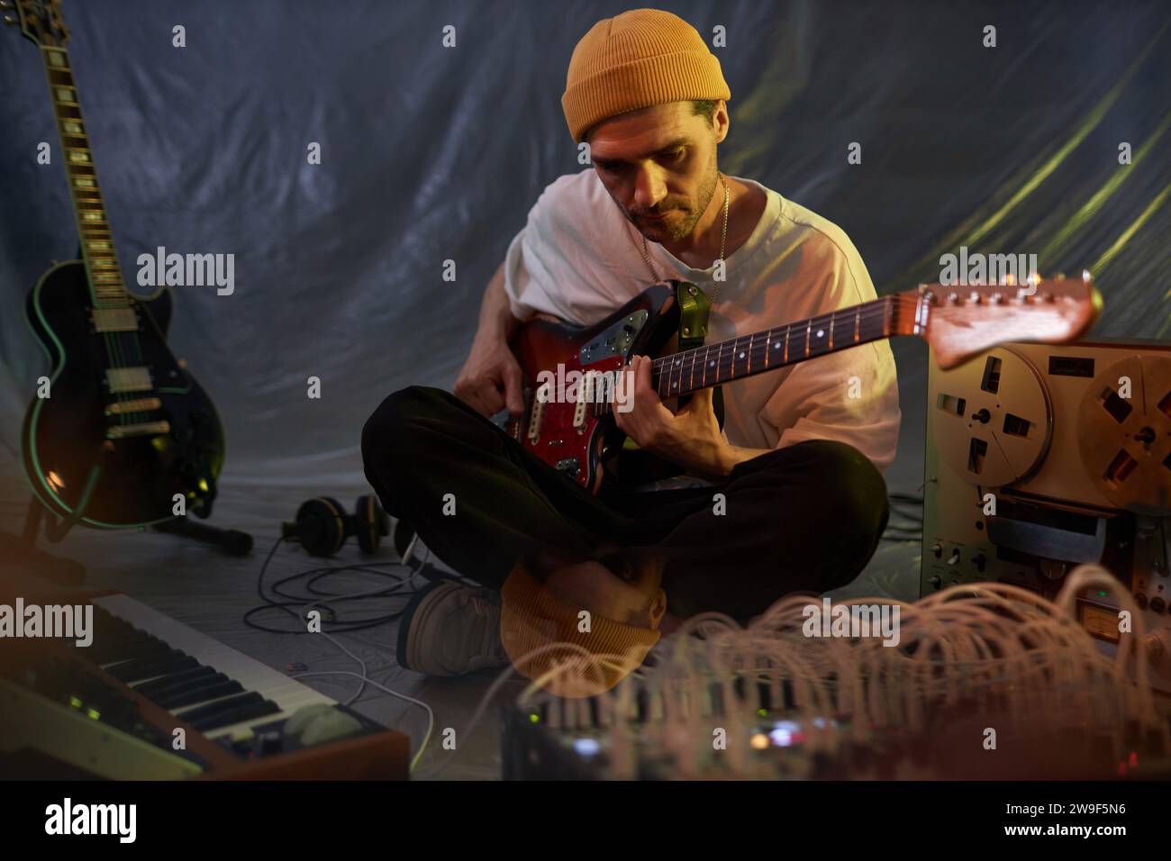 Male Guitarist Recording Melancholic Guitar Melody Stock Photo - Alamy