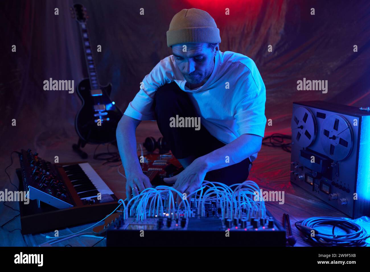 Musician Doing Sound Check in Makeshift Studio Stock Photo - Alamy