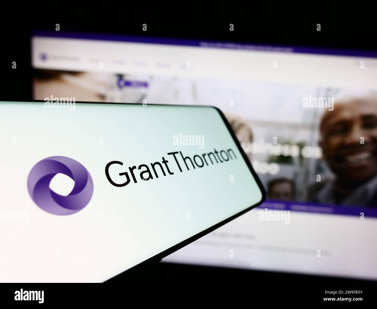Smartphone with logo of consulting company Grant Thornton International ...