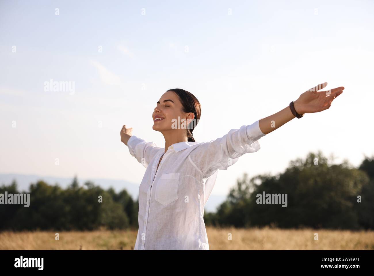 Woman wide open arms enjoying hi-res stock photography and images - Alamy