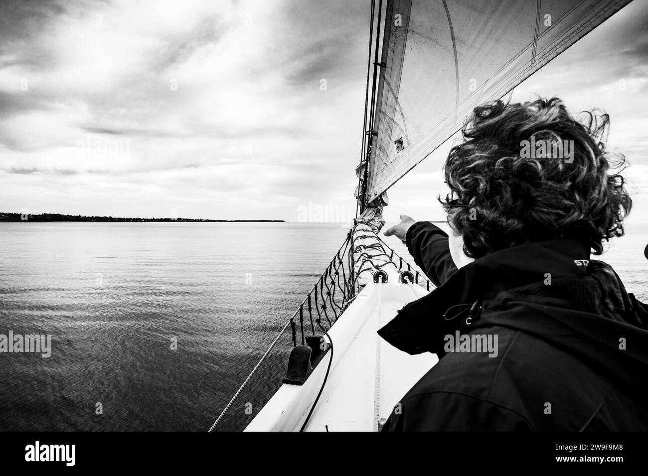 Crew member acts as a lookout at the bow onboard the replica Grand ...