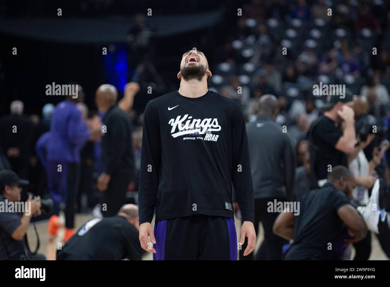 Sacramento Kings guard Chris Duarte breaks out in laughter during the ...