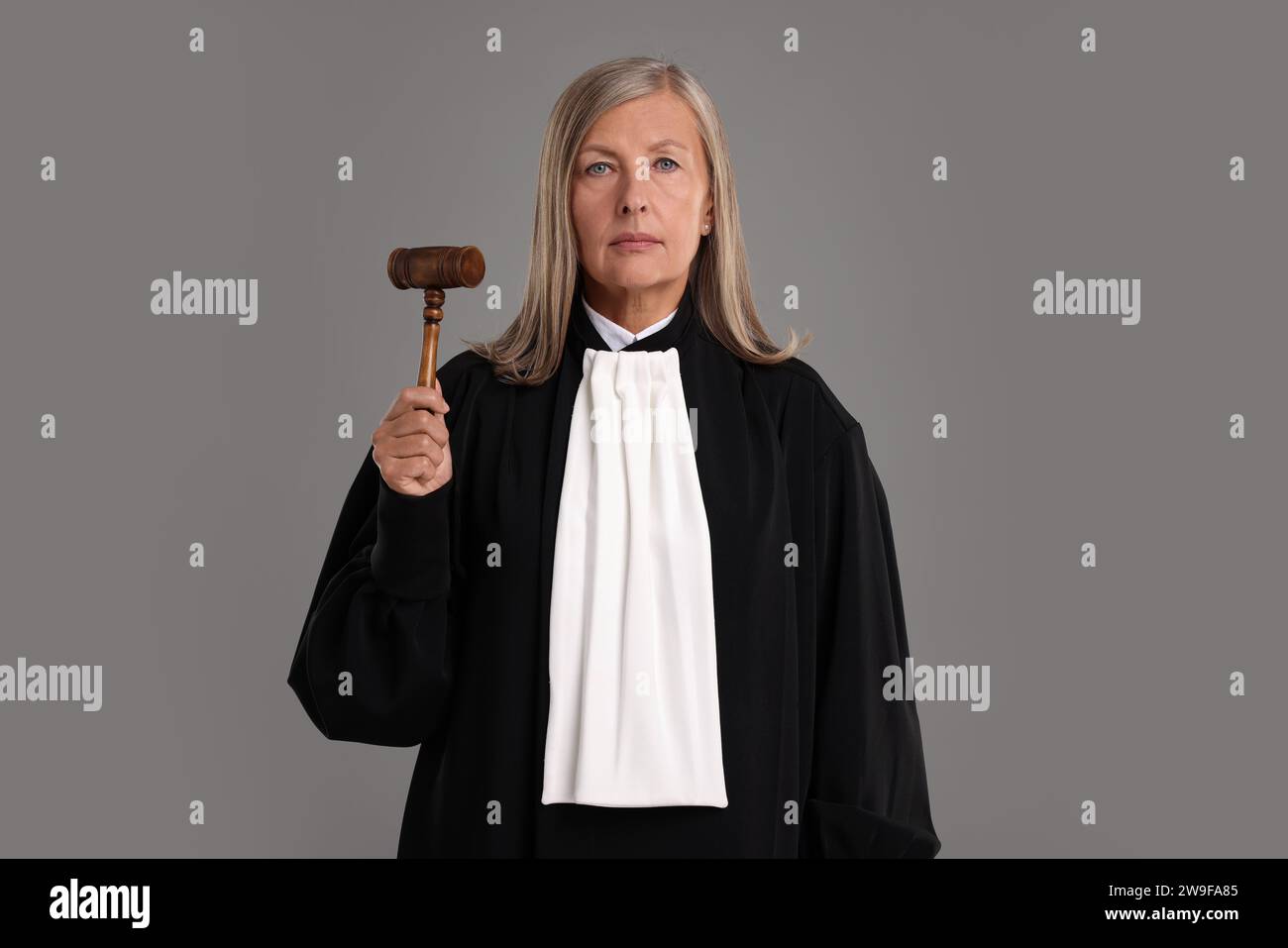 Senior judge with gavel on grey background Stock Photo - Alamy Senior judge with gavel on grey background Stock Photo - Alamy