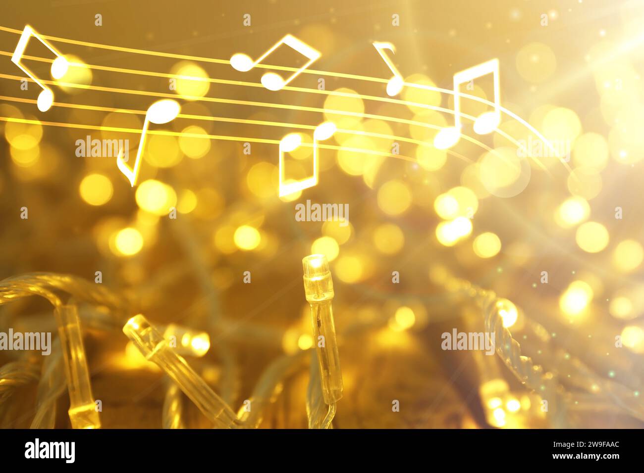 Music notes and Christmas lights, bokeh effect Stock Photo - Alamy