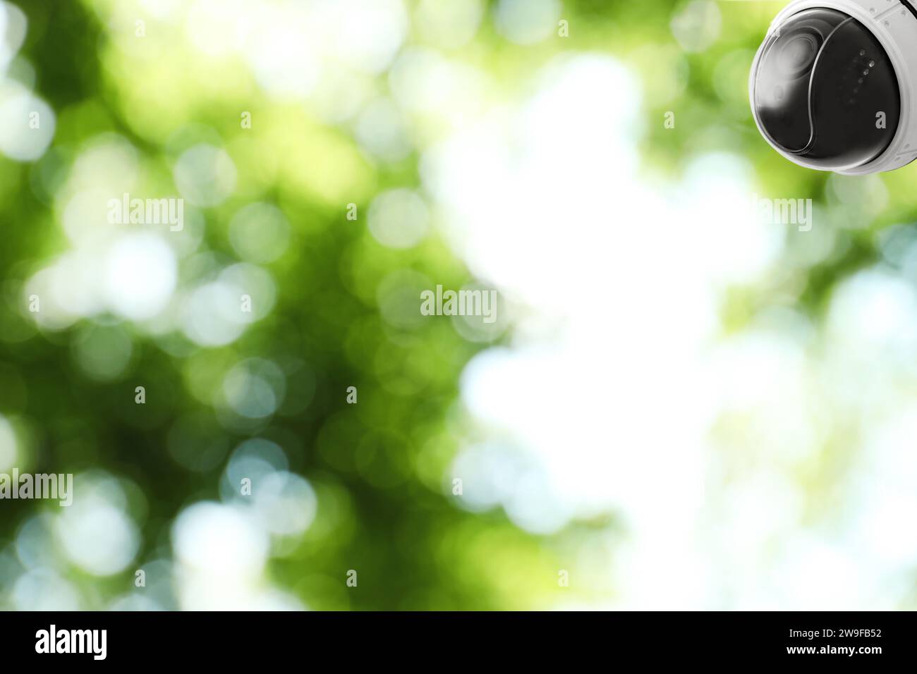 Modern security CCTV camera outdoors, space for text Stock Photo - Alamy