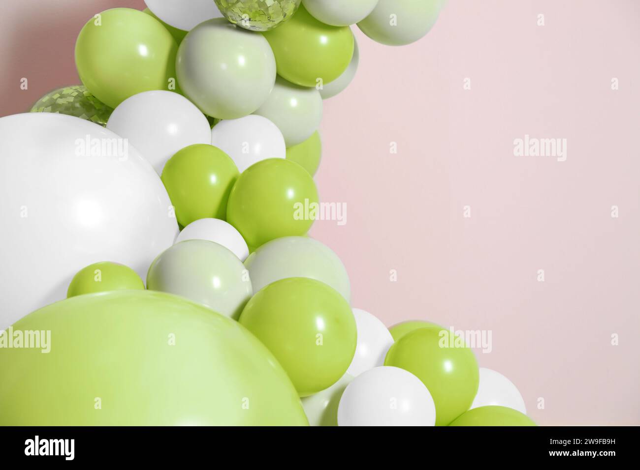 Balloon garland on beige background. Festive decor Stock Photo - Alamy