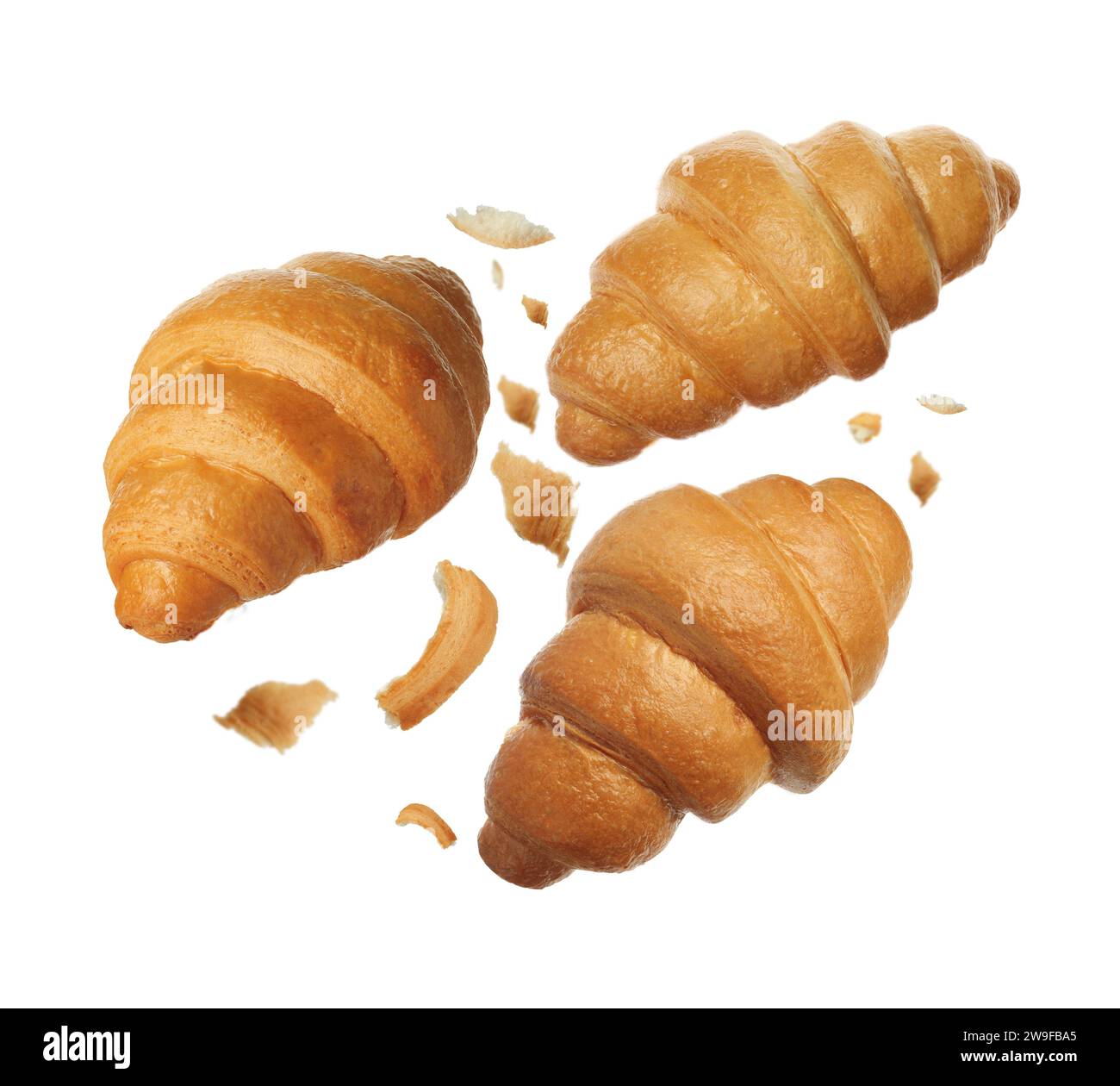 Delicious fresh croissants falling on white background Stock Photo - Alamy