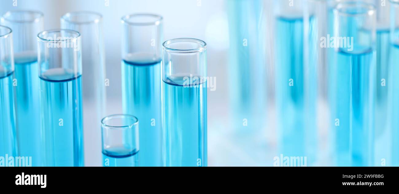 Laboratory analysis. Test tubes with liquid samples against blurred ...