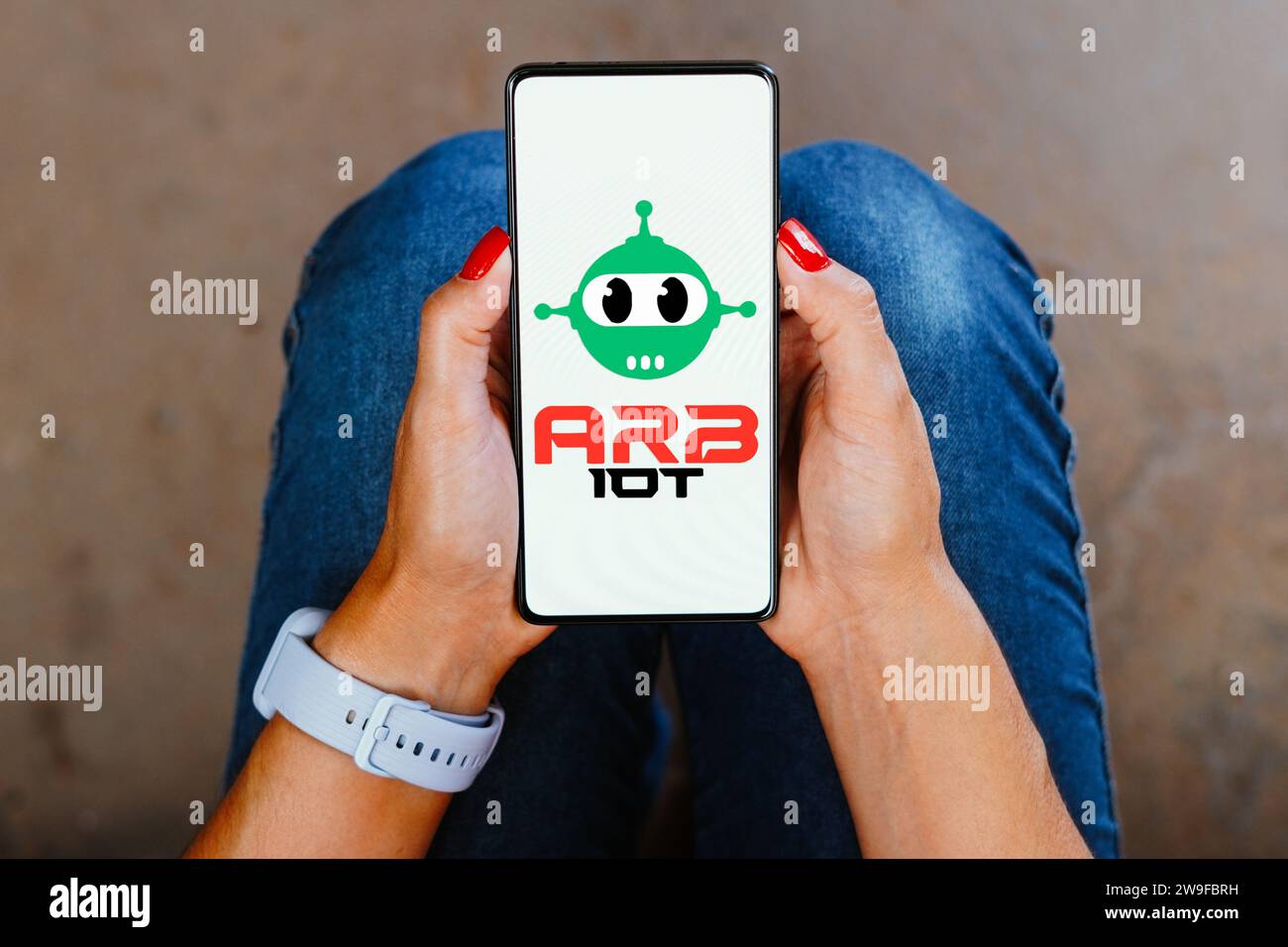 In this photo illustration, the ARB IOT Group Limited logo is displayed ...