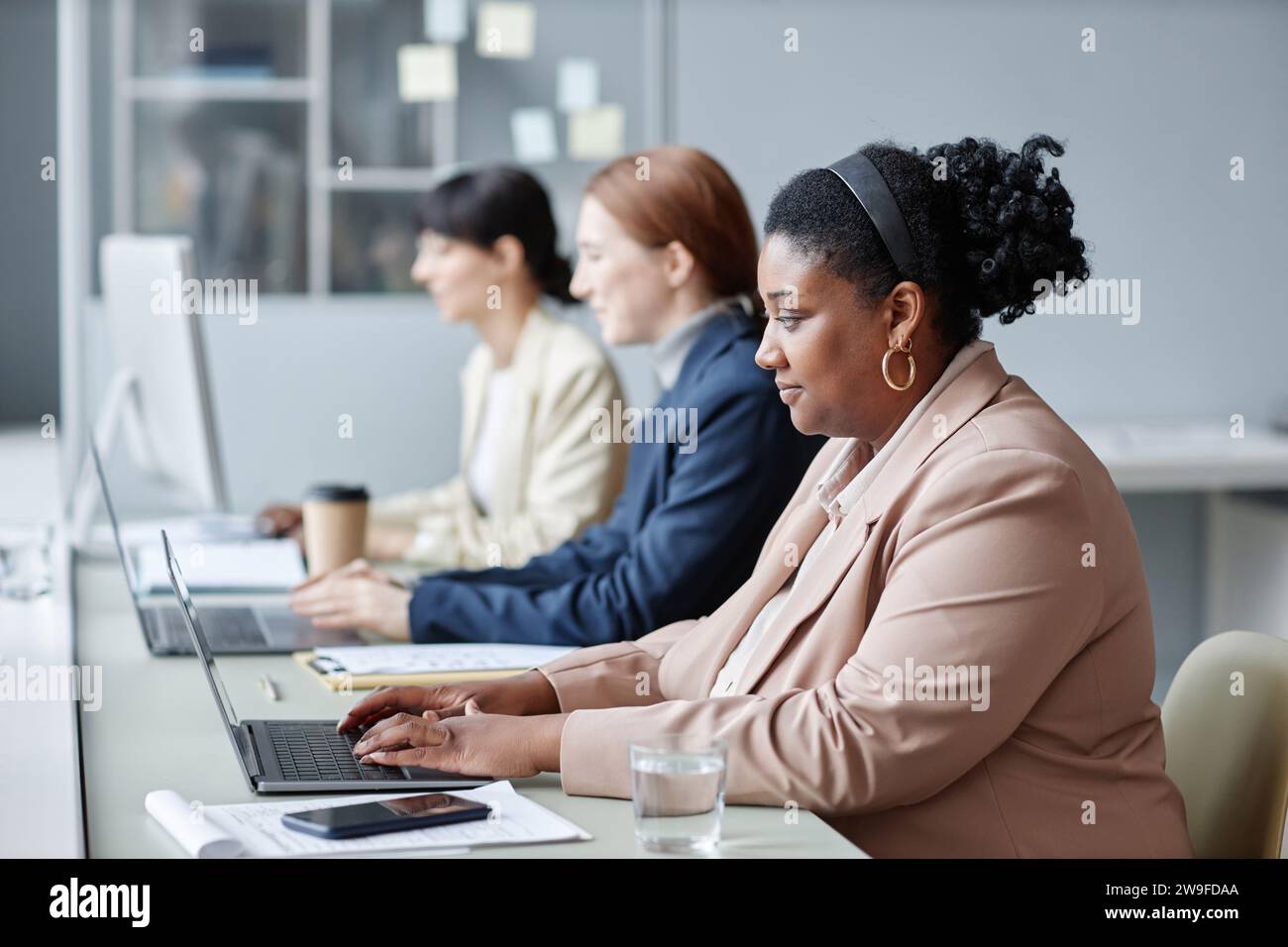 African american workers using laptop hi-res stock photography and ...