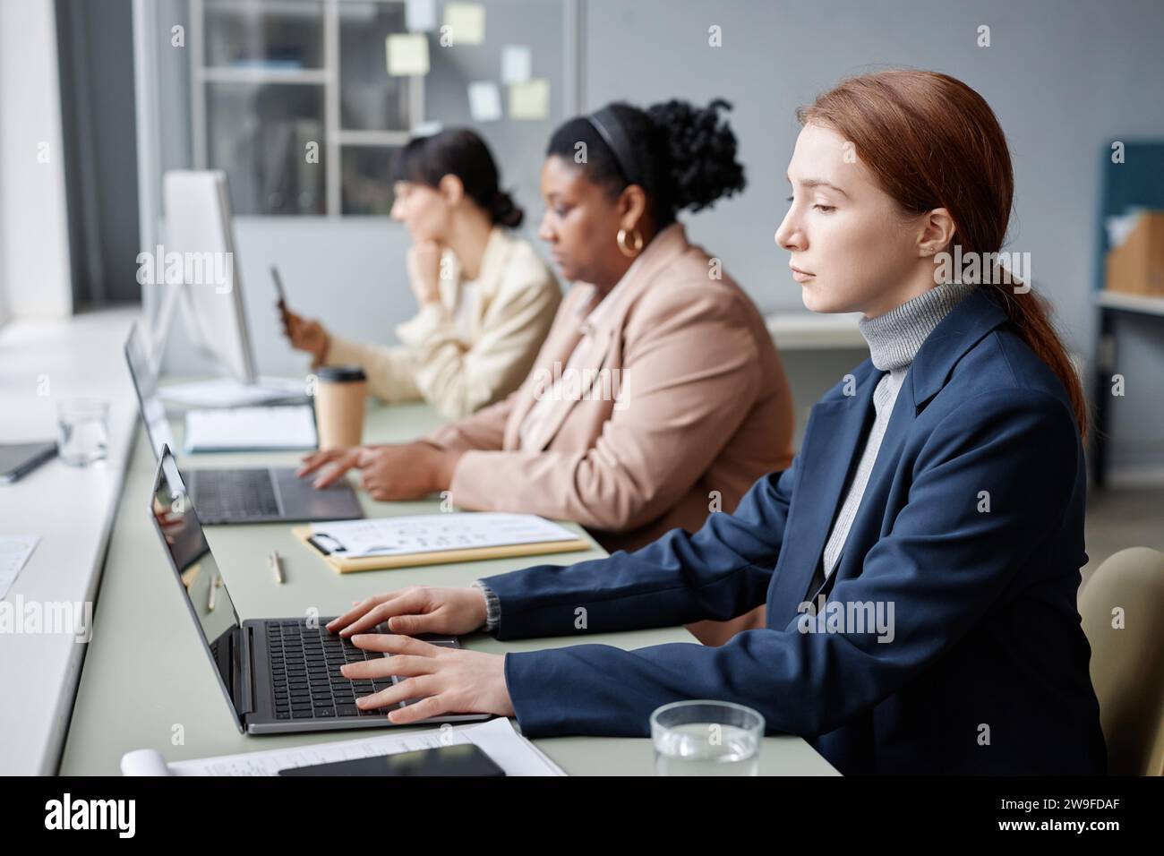 Female Company Employees Working on Computers in Office Stock Photo - Alamy