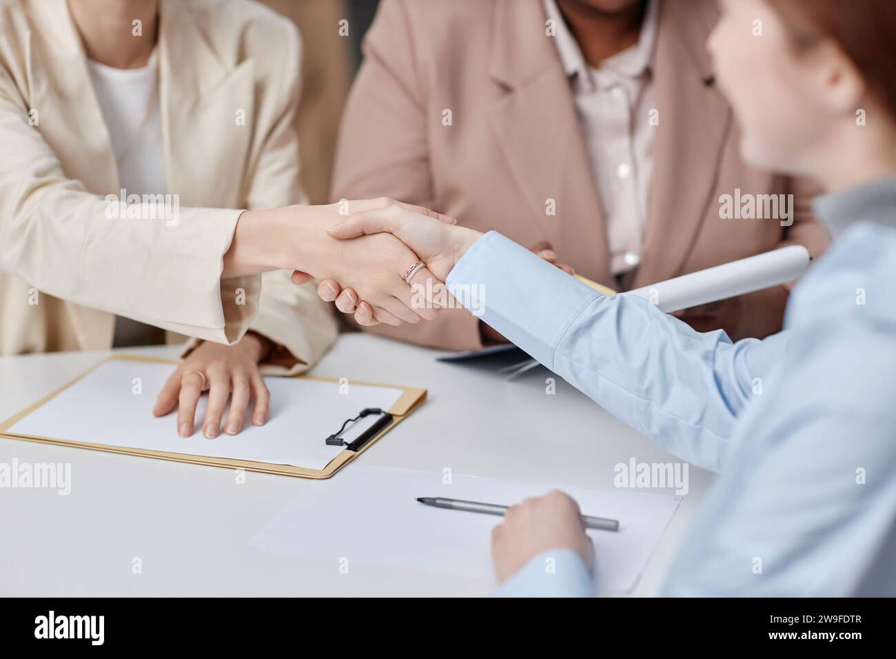 Corporate Workers Reaching Agreement Doing Handshake Stock Photo - Alamy