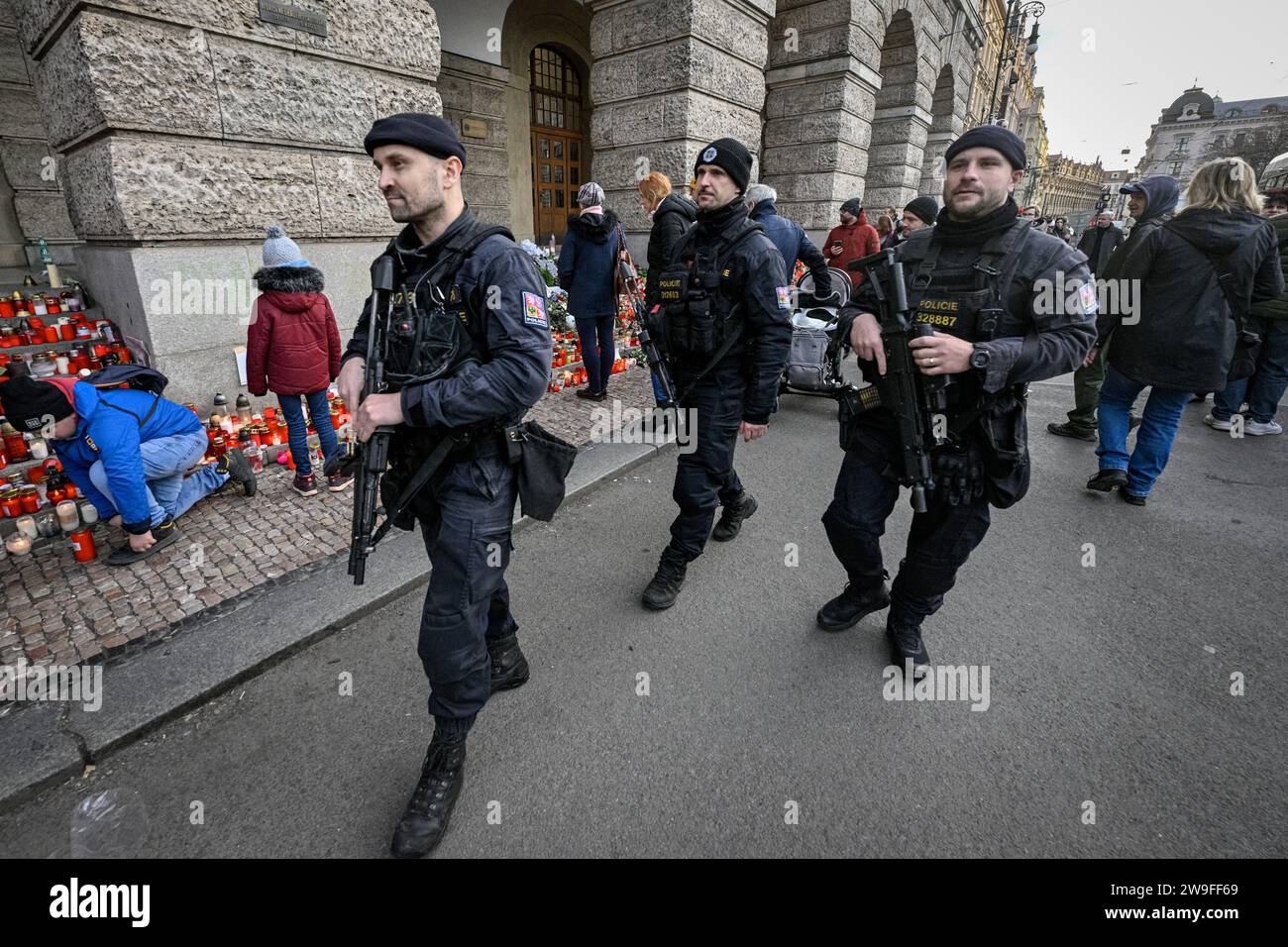 Prague, Czech Republic. 27th Dec, 2023. People light candles in front ...