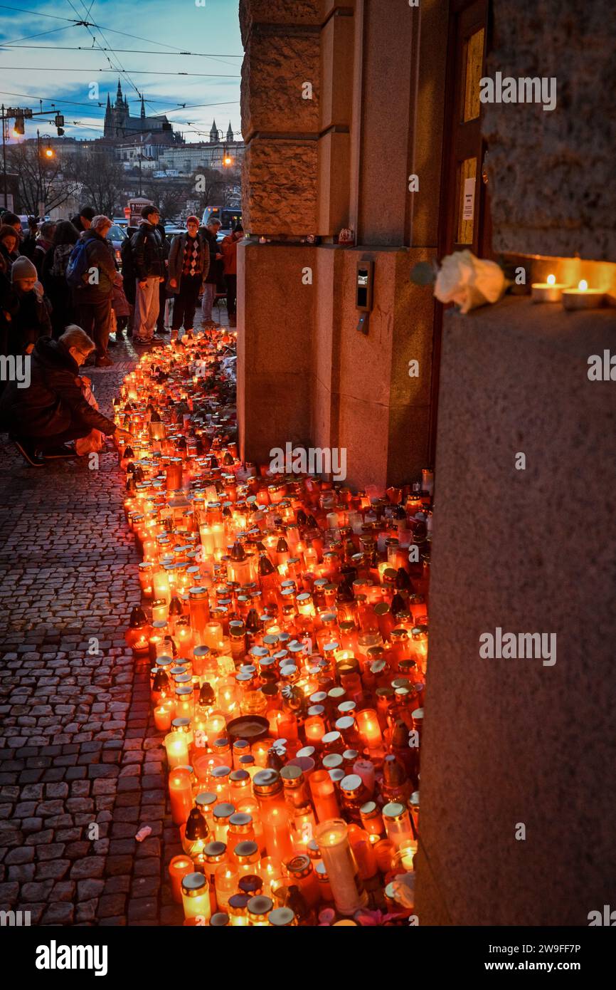 Prague, Czech Republic. 27th Dec, 2023. People light candles in front ...