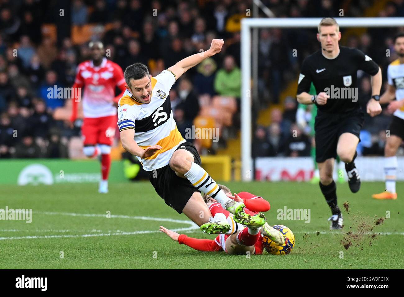 Burslem, UK, 26th December 2023. Port Vale's number 8, Ben Garrity, is ...
