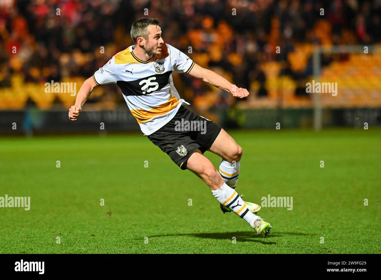 Burslem, UK, 26th December 2023. Port Vale's number 8, Ben Garrity, in ...