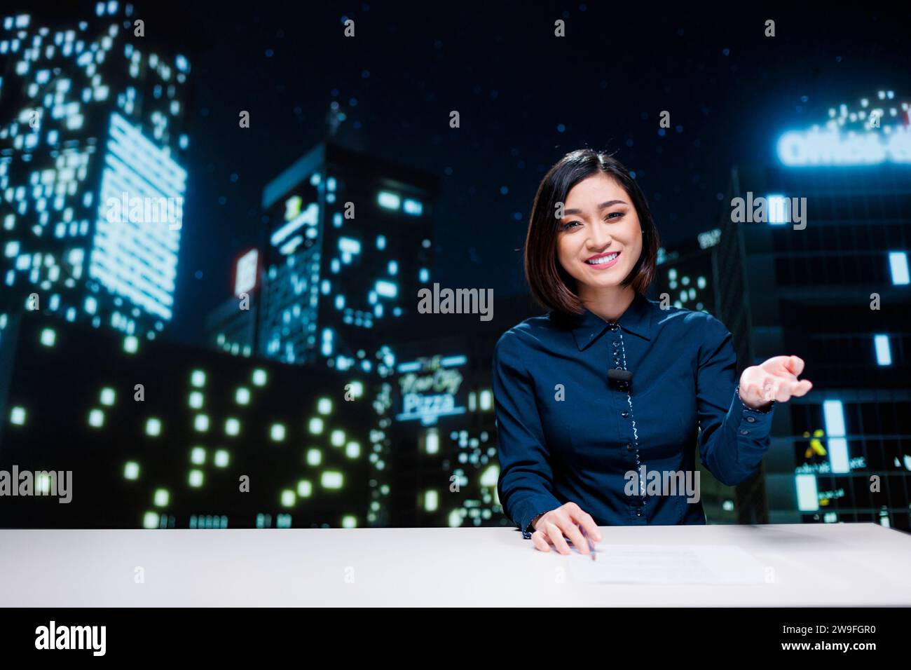 Presenter going live on transmission to open news segment for ...