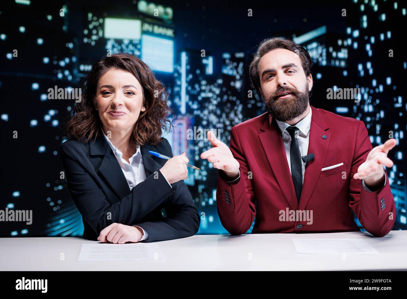 Newscasters team debating live topics on tv channel, broadcasting night ...