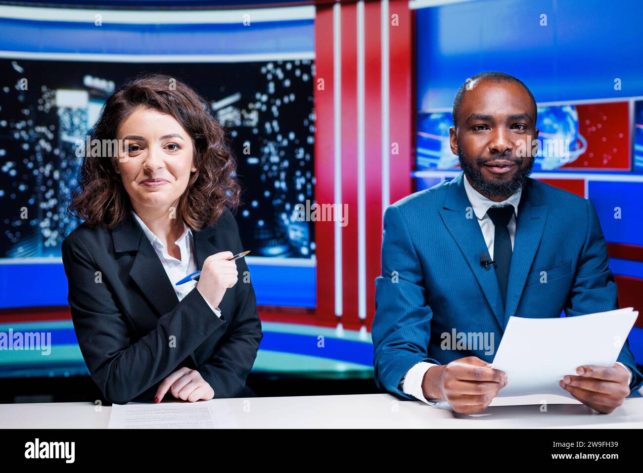 Journalists team reporting live news in newsroom, working to deliver ...