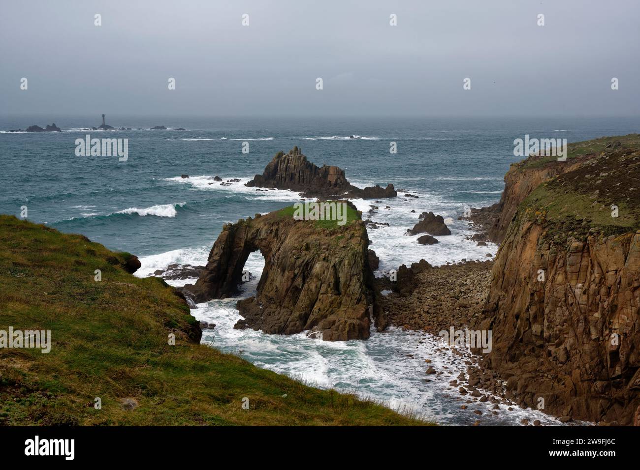 Rock Arch of Enys Dodnan with Armed Knight Rocks and Longships ...