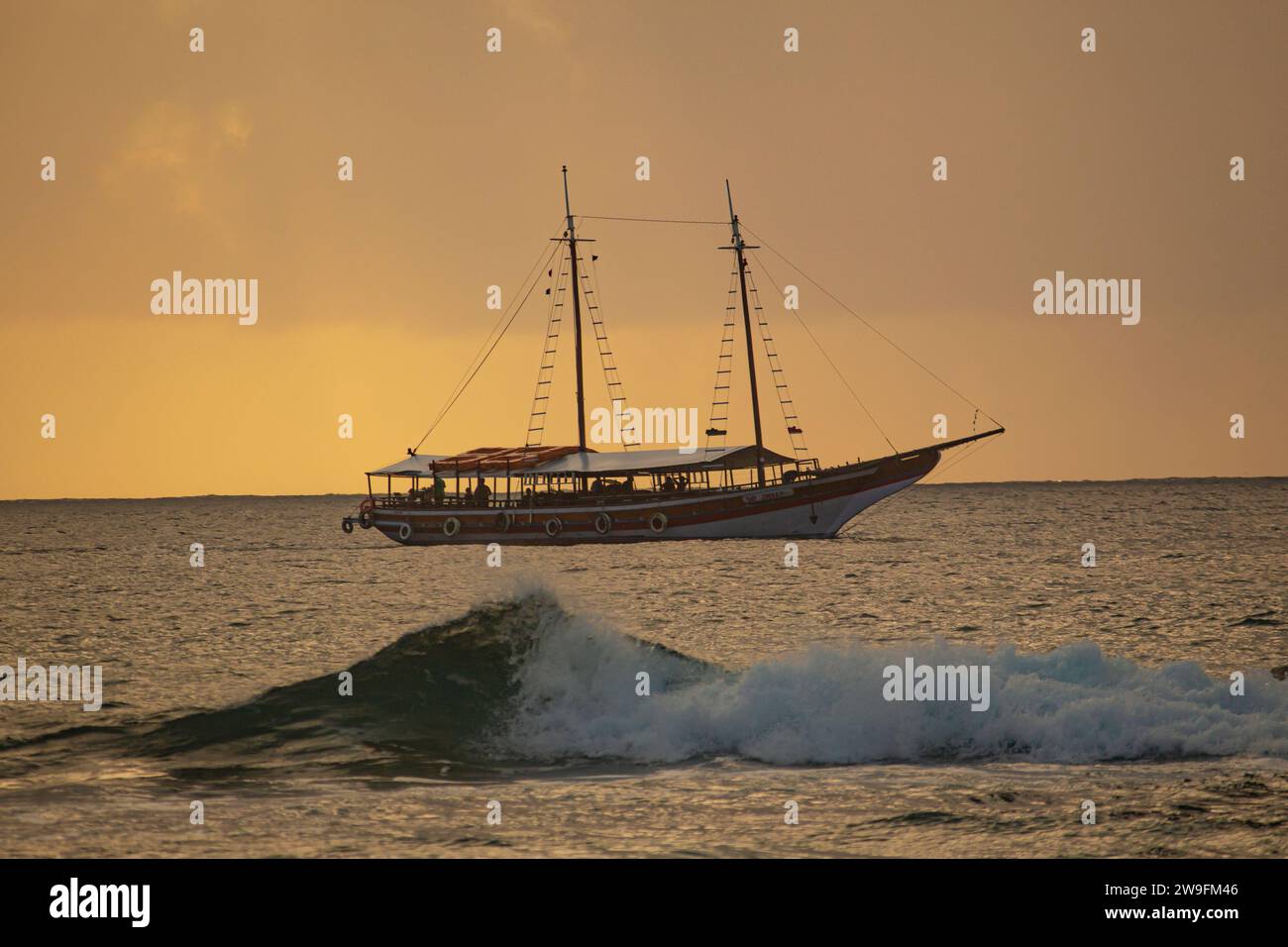 Tourist schooner boat sails at sunset in Brazil Stock Photo - Alamy