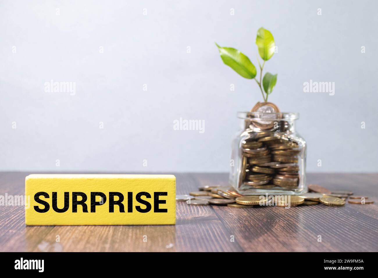 SURPRISE appearing behind torn paper. Business Stock Photo - Alamy