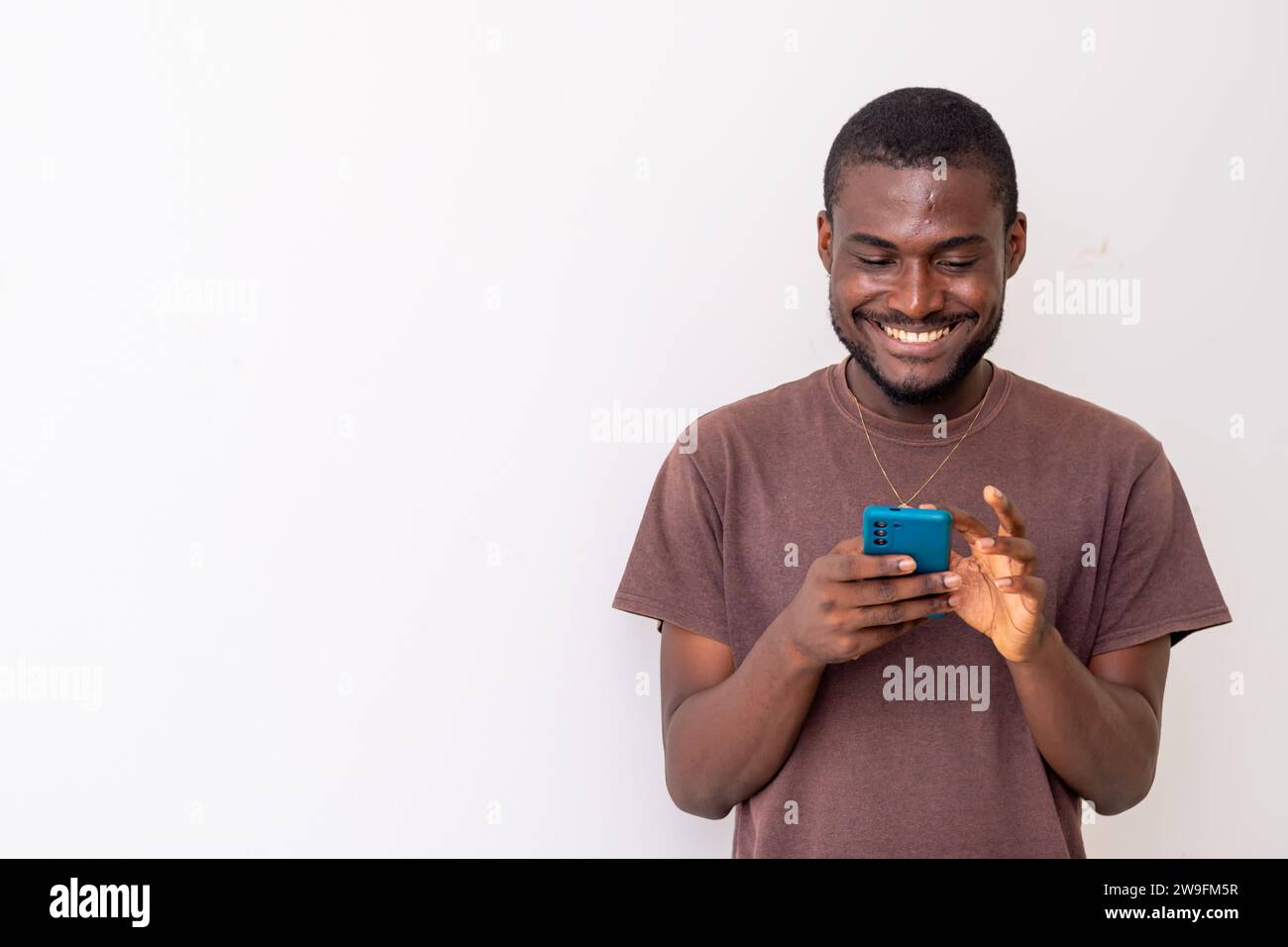African american man using mobile phone and pressing with a finger ...