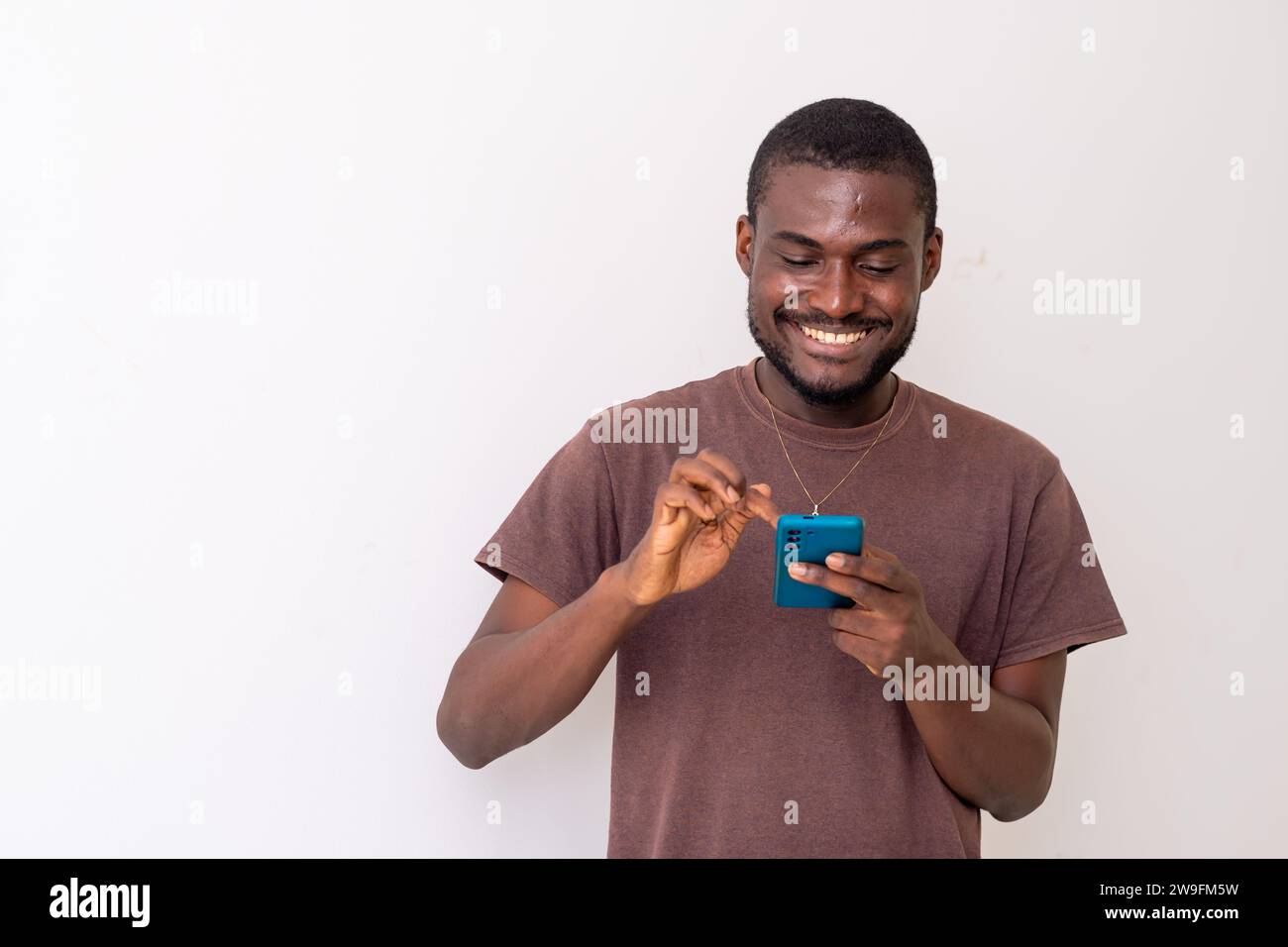African american man using mobile phone and pressing with a finger ...