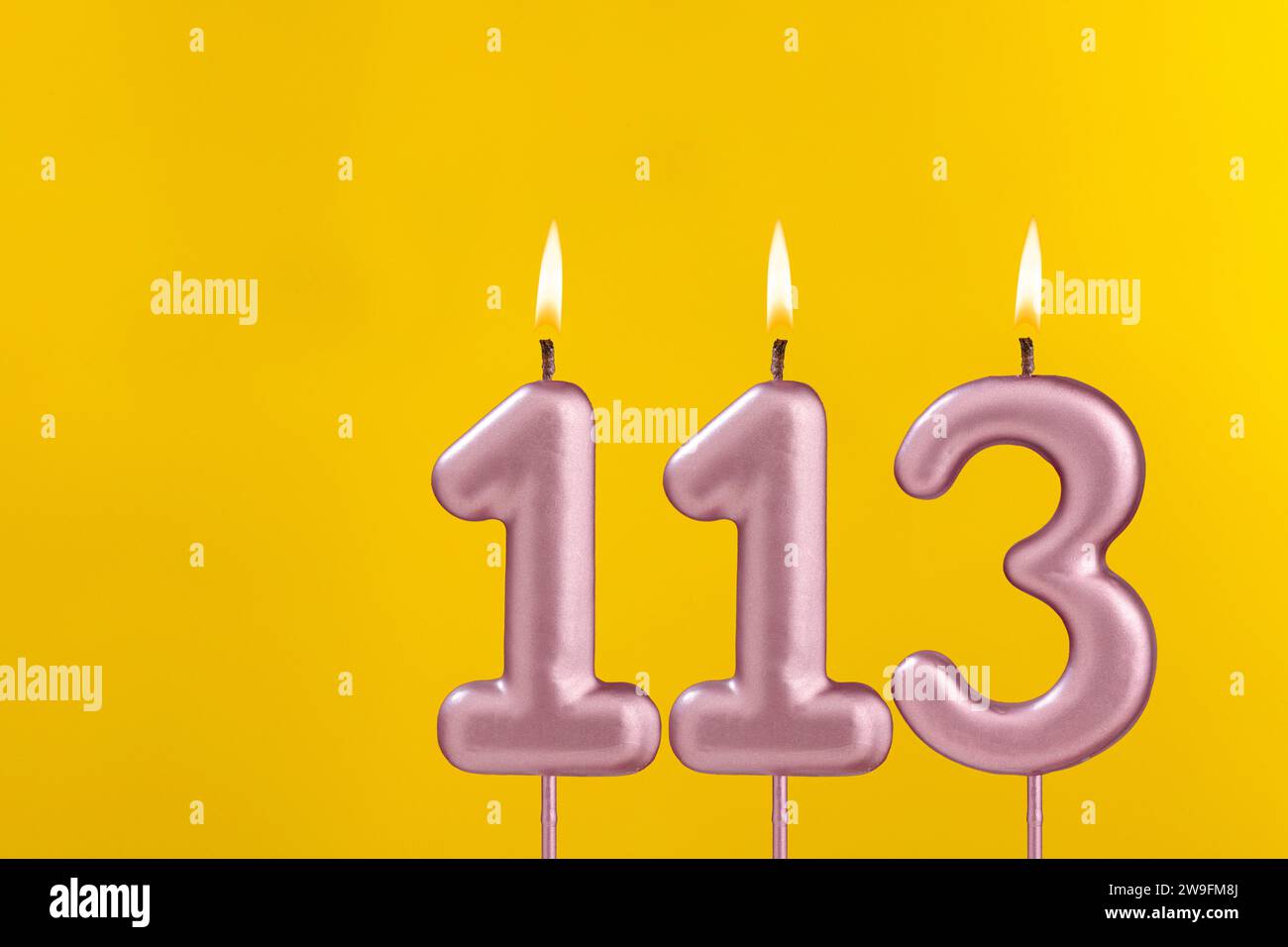 Birthday candle number 113 - Birthday celebration on yellow background ...