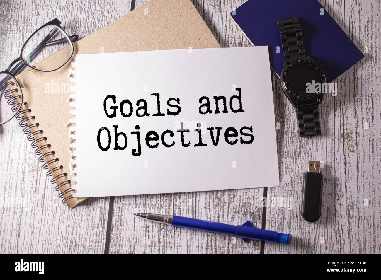 Notepad with GOALS OBJECTIVES text inscription on notepad on a light ...