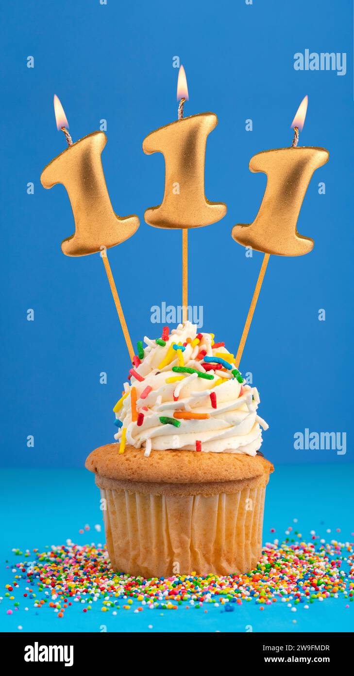 Candle number 111 - Cake birthday in blue background Stock Photo - Alamy
