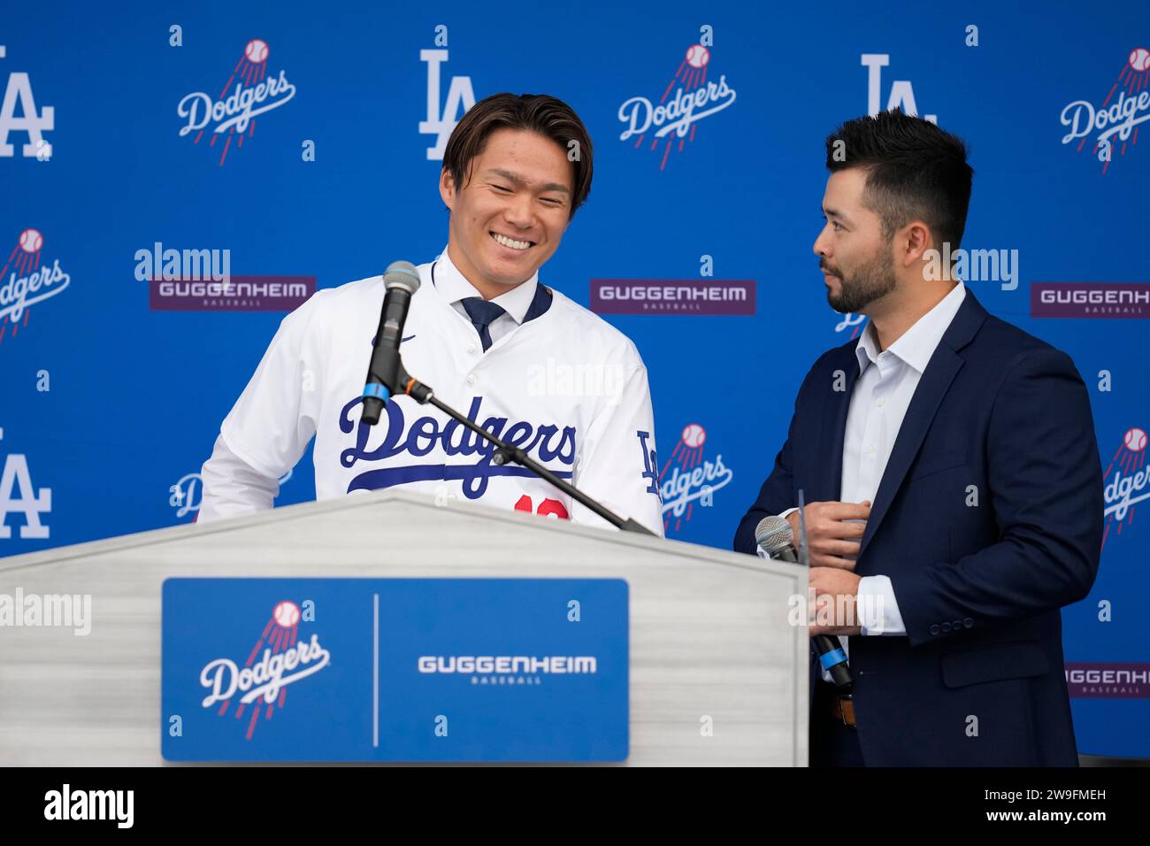 Yoshinobu Yamamoto smiles next to interpreter Mako Allbee during his ...