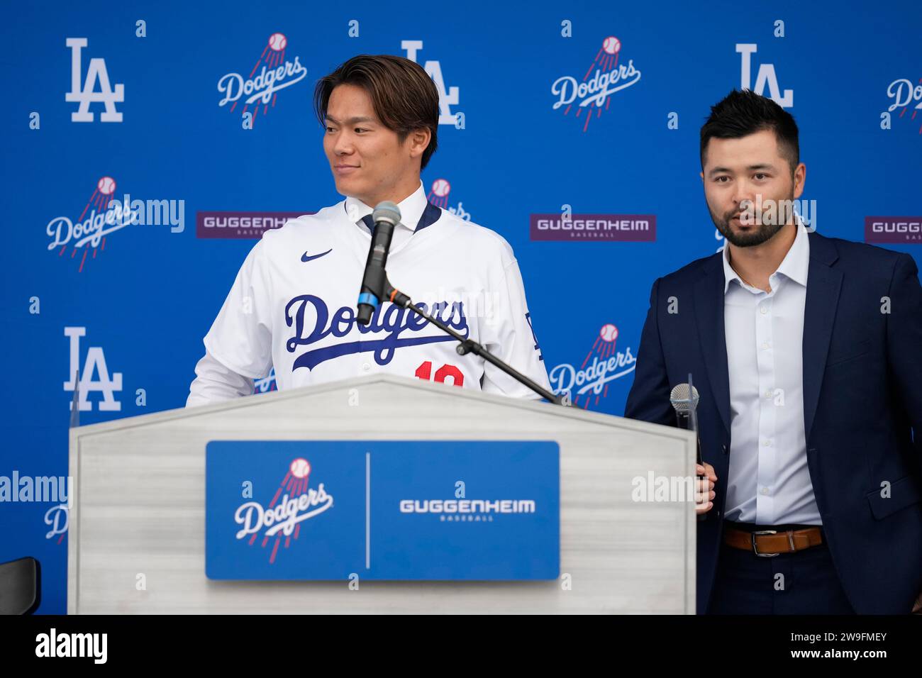 Yoshinobu Yamamoto speaks next to interpreter Mako Allbee during his ...