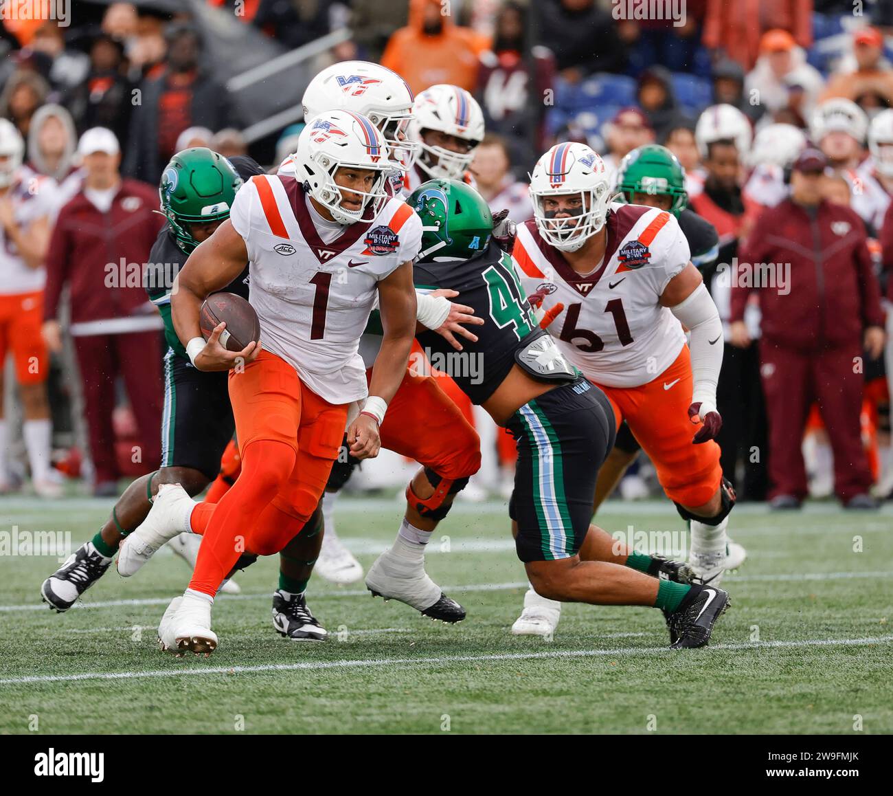 Annapolis, MD, USA. 27th Dec, 2023. Virginia Tech Hokies QB #1 Kyron Drones runs with the ball ...
